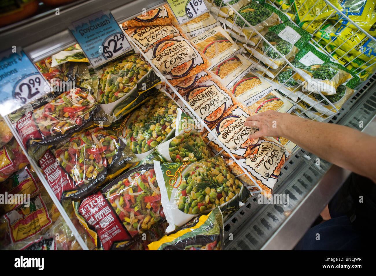 Shoppers in the new Trader Joe's supermarket the Chelsea neighborhood ...