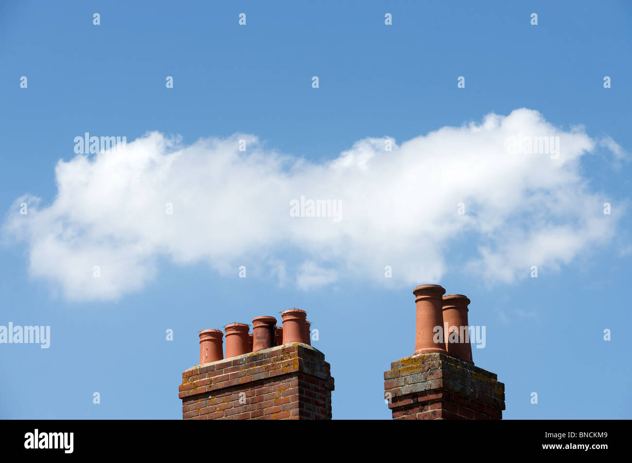 Cloud appearing to look like smoke coming out of a chimney Stock Photo ...