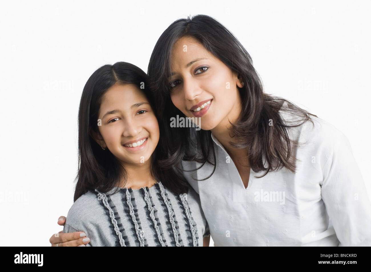 Portrait of a woman smiling with her daughter Stock Photo - Alamy