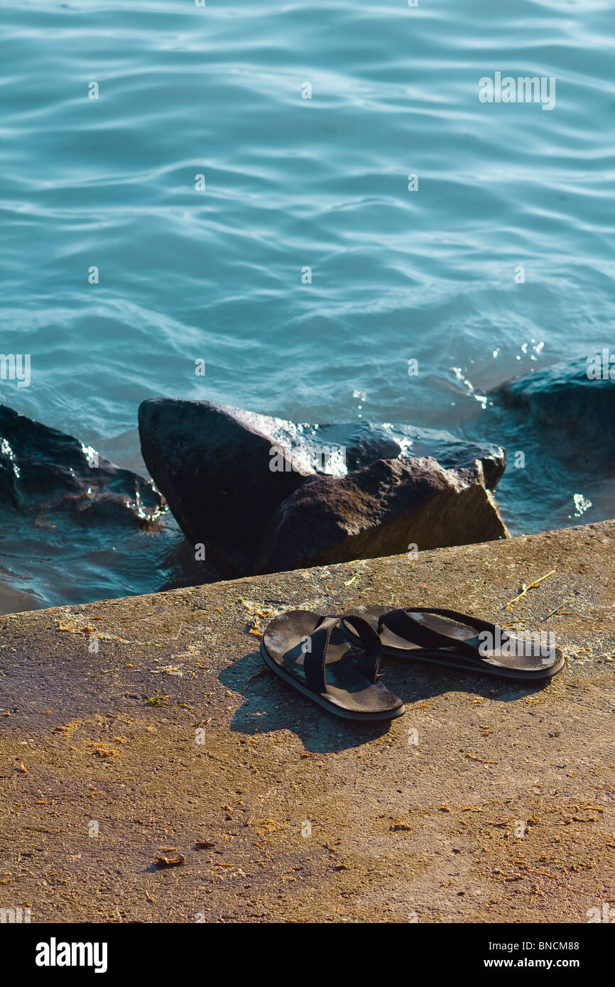 A pair of slippers on the beach Stock Photo - Alamy