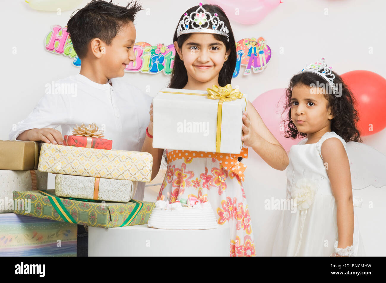 Children with birthday presents Stock Photo - Alamy