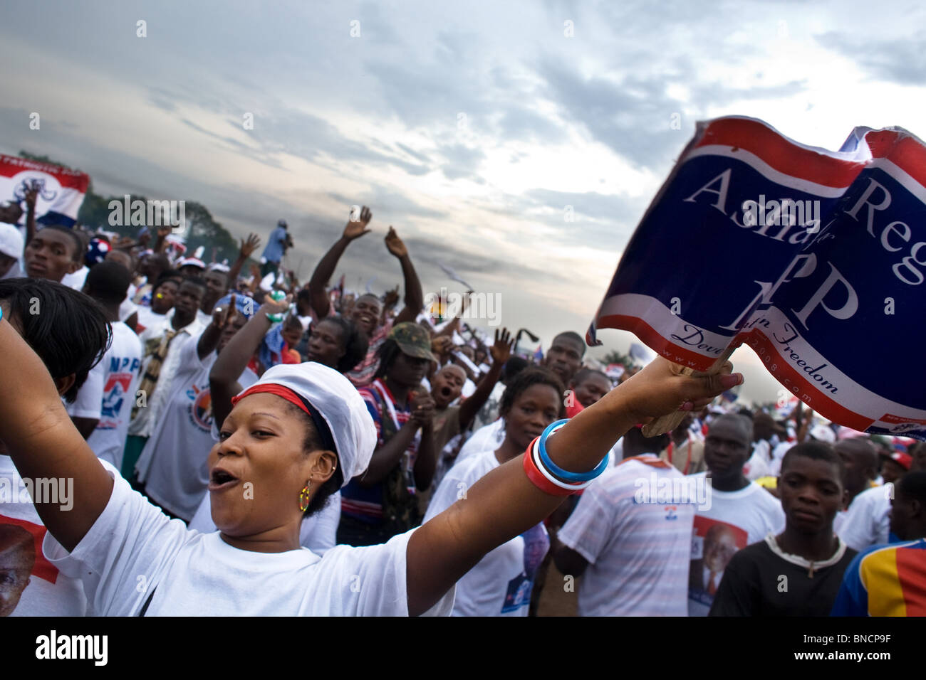 Supporters of the New Patriotic Party (NPP) cheer during a campaign ...
