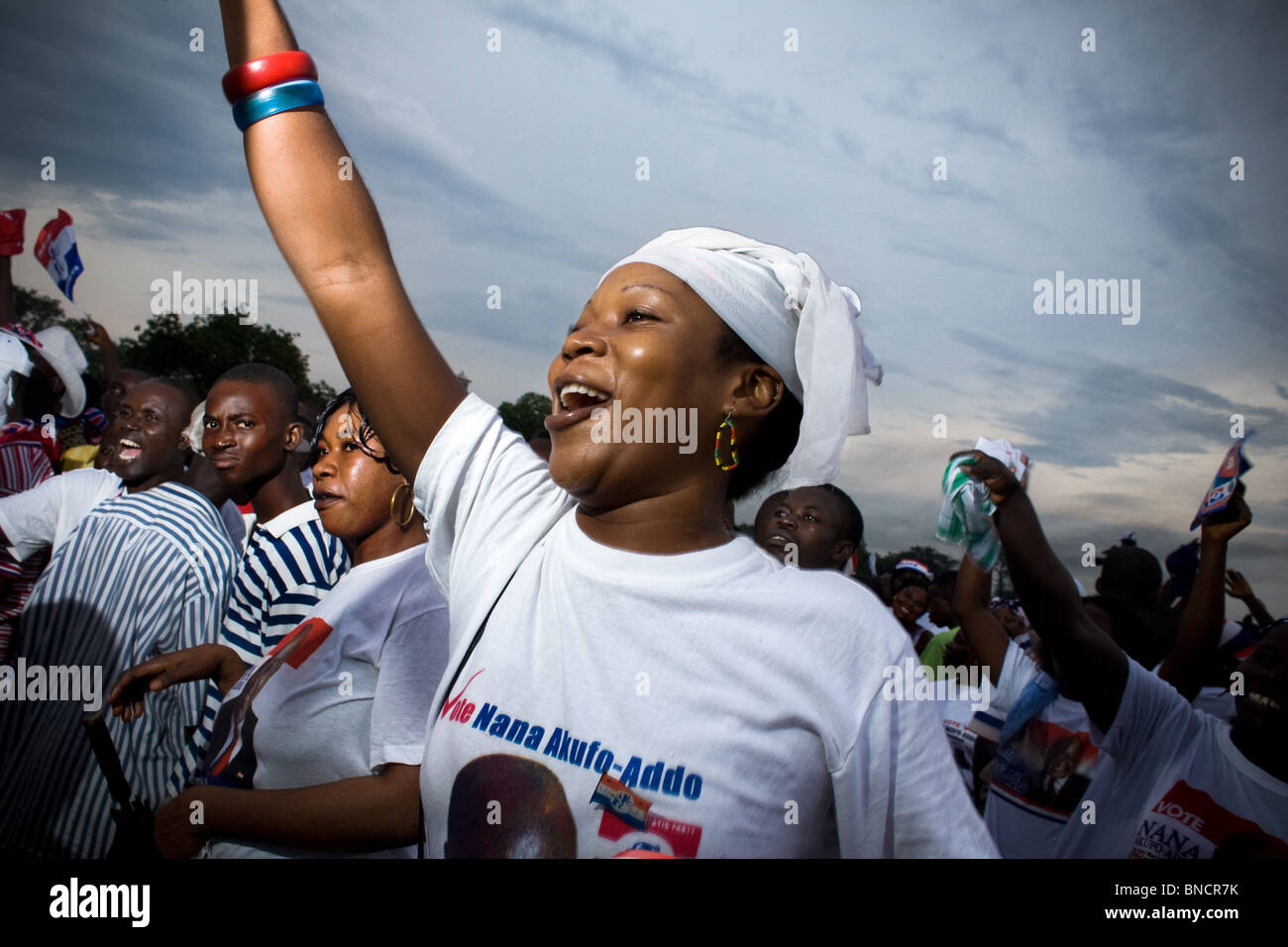 Supporters of the New Patriotic Party (NPP) cheer during a campaign ...