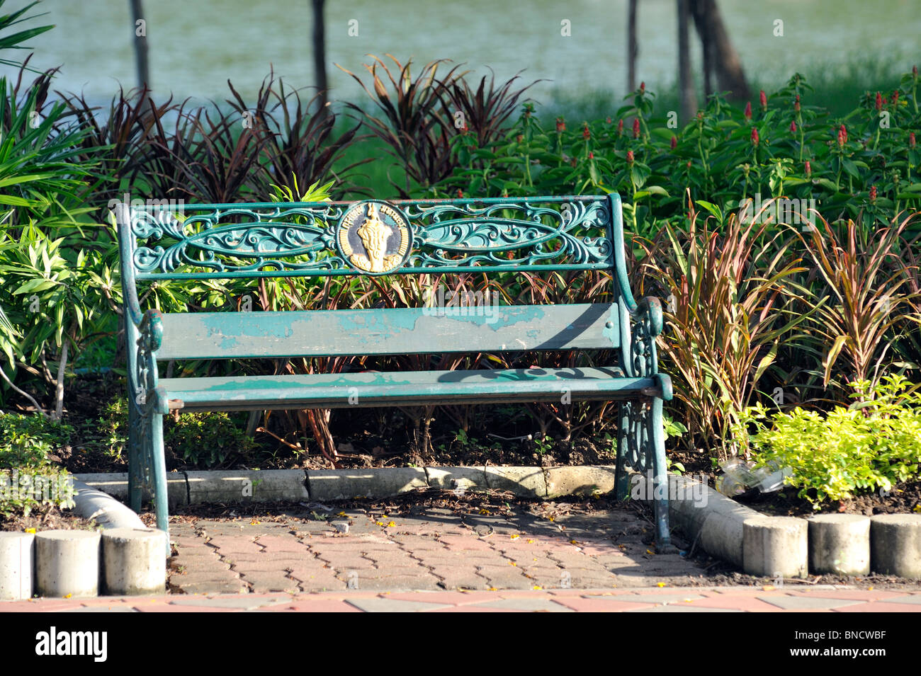 Park Bench with royal Crest, Lumpini Park, Bangkok, Thailand Stock ...
