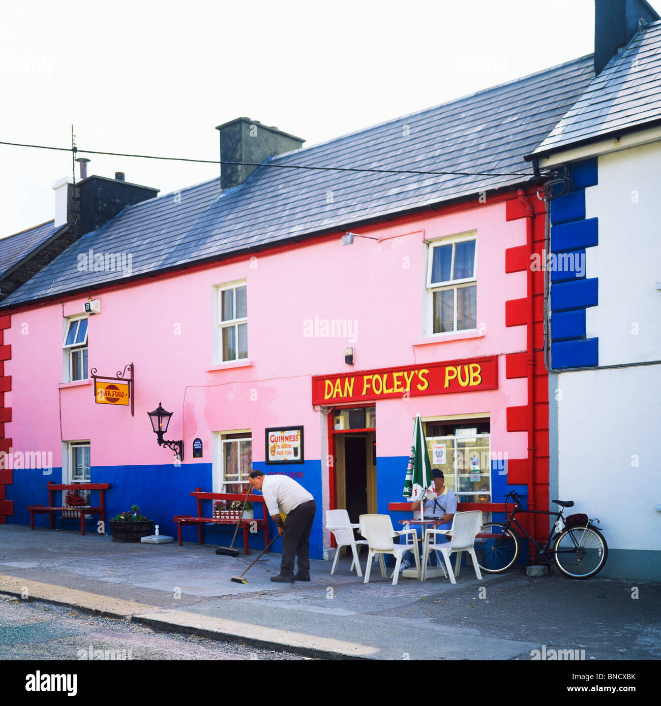 DAN FOLEY SWEEPING PUB PAVEMENT ANASCAUL DINGLE PENINSULA COUNTY KERRY ...