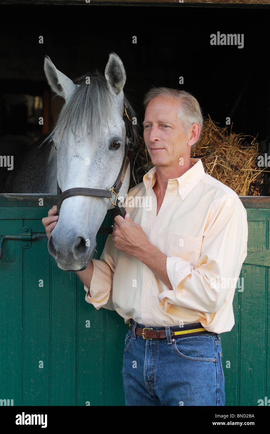 man and horse in barn Stock Photo - Alamy