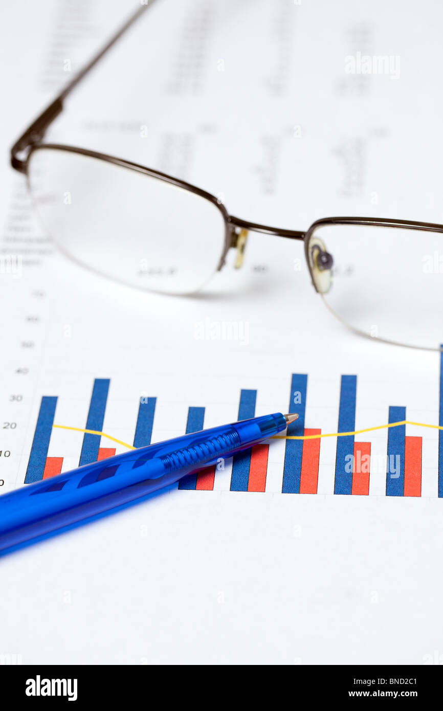 the financial graph with pen Stock Photo - Alamy