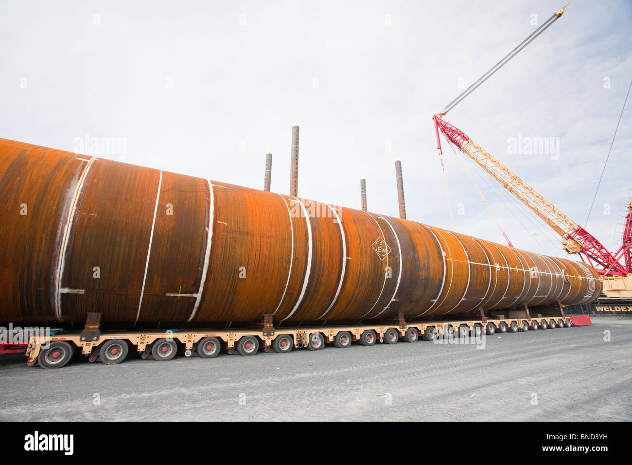 A monopile for an off shore wind turbine on a low loader Stock Photo ...
