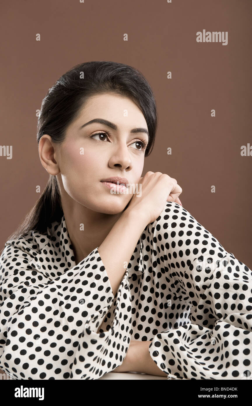 Close-up of a woman thinking Stock Photo - Alamy