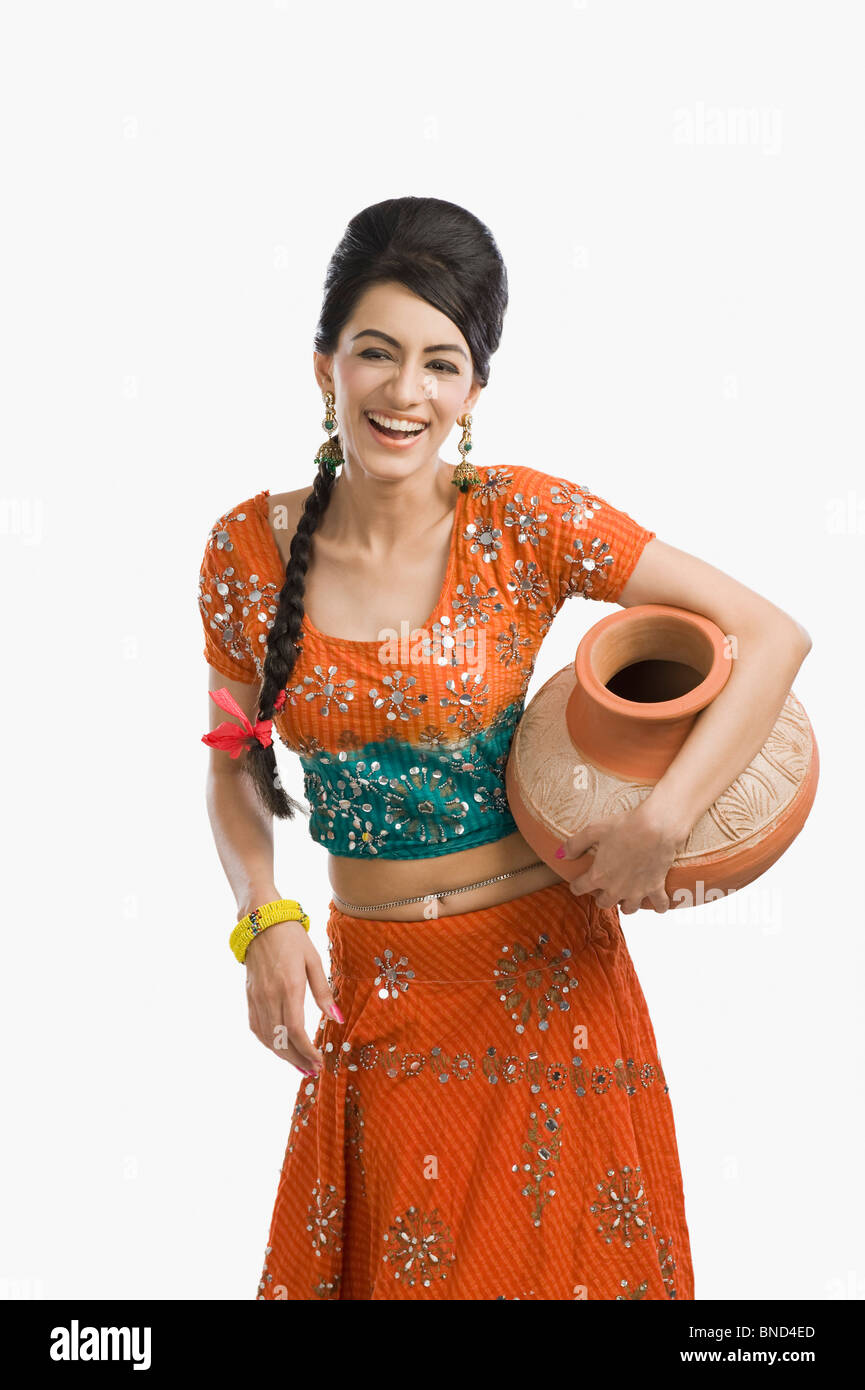 Indian woman holding water pot hi-res stock photography and images - Alamy