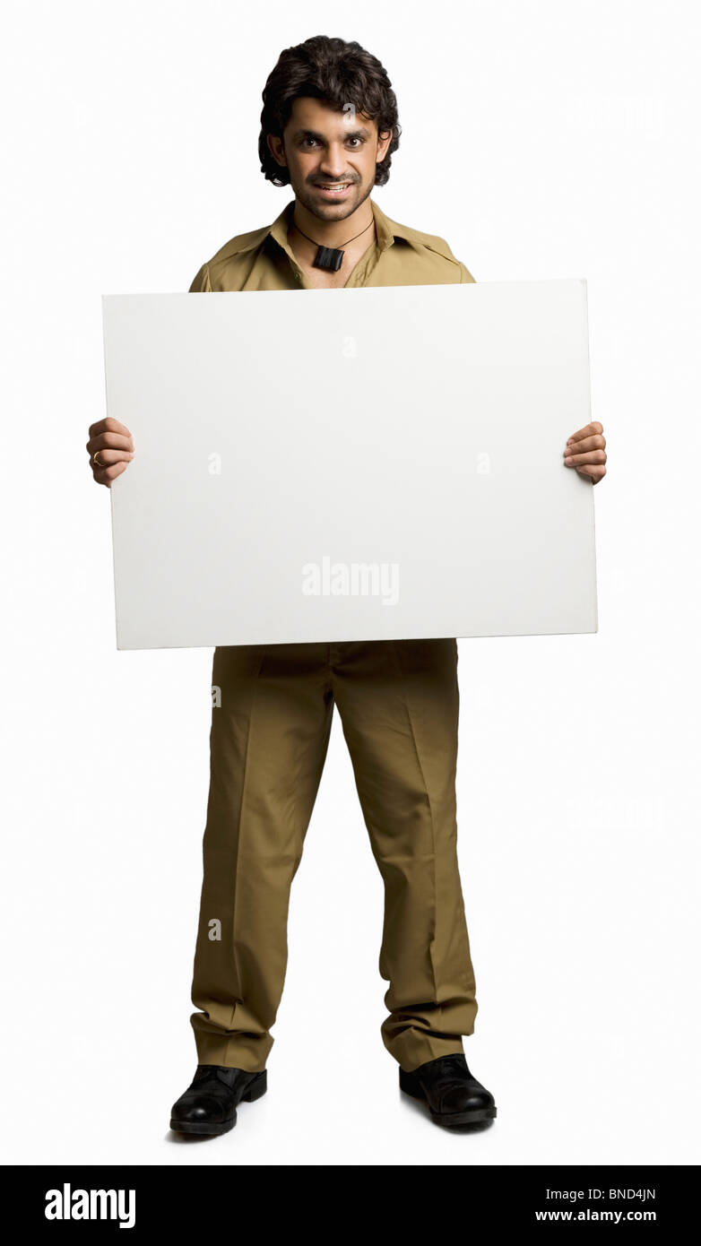Portrait of an actor portraying Gabbar Singh holding a blank placard ...