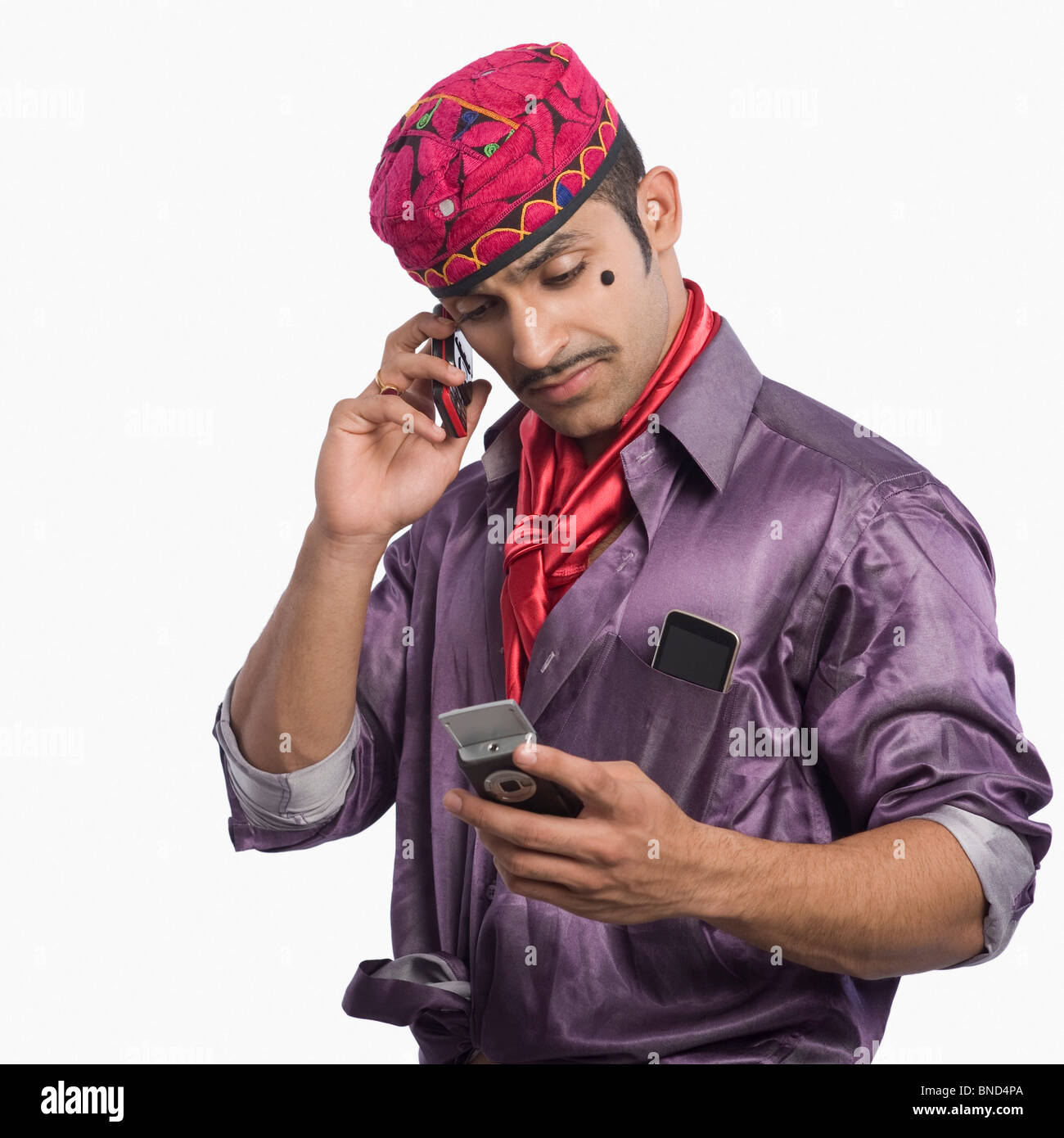Actor portraying a tapori using mobile phones Stock Photo - Alamy