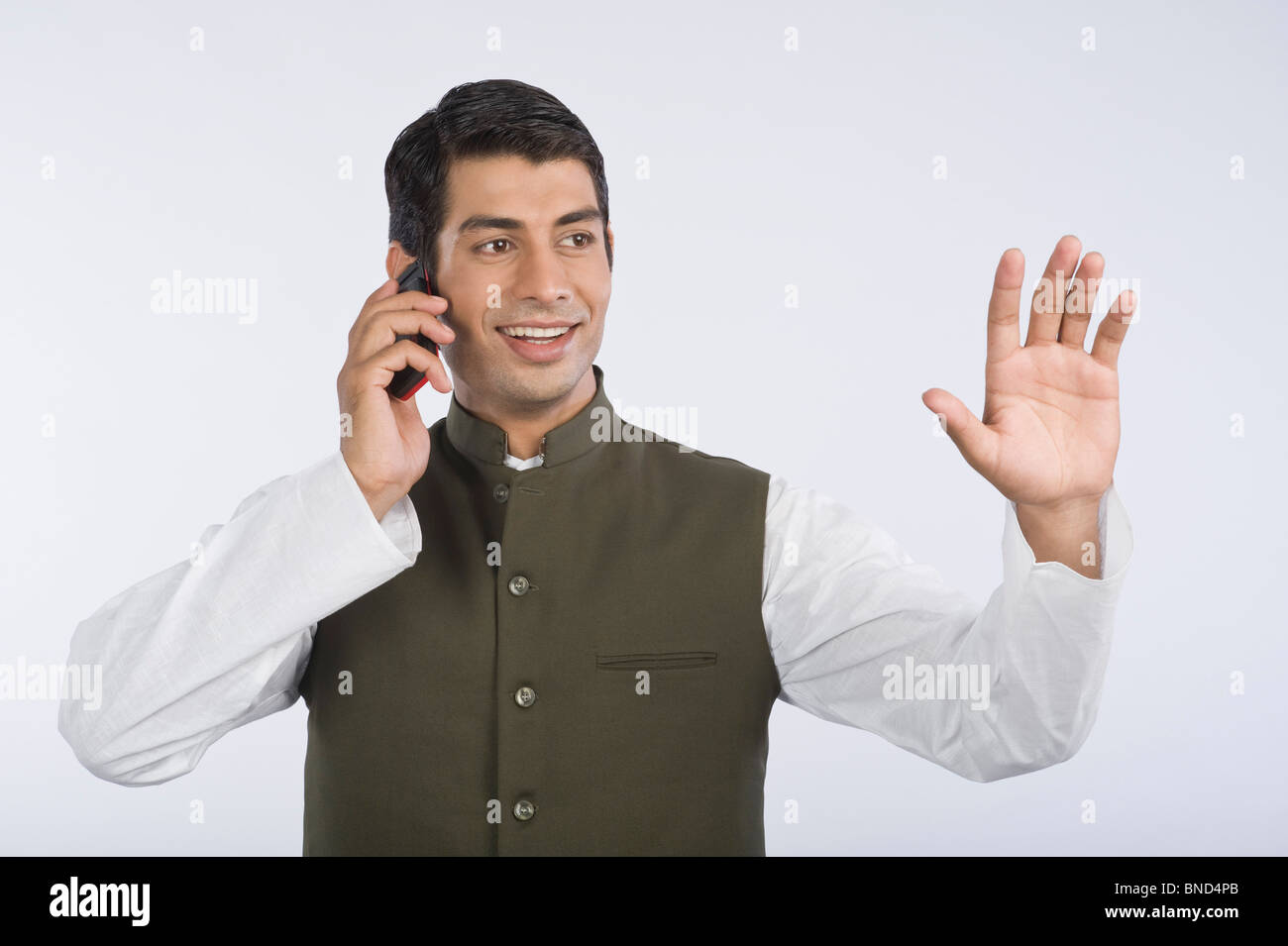 Actor portraying a politician talking on a mobile phone Stock Photo - Alamy