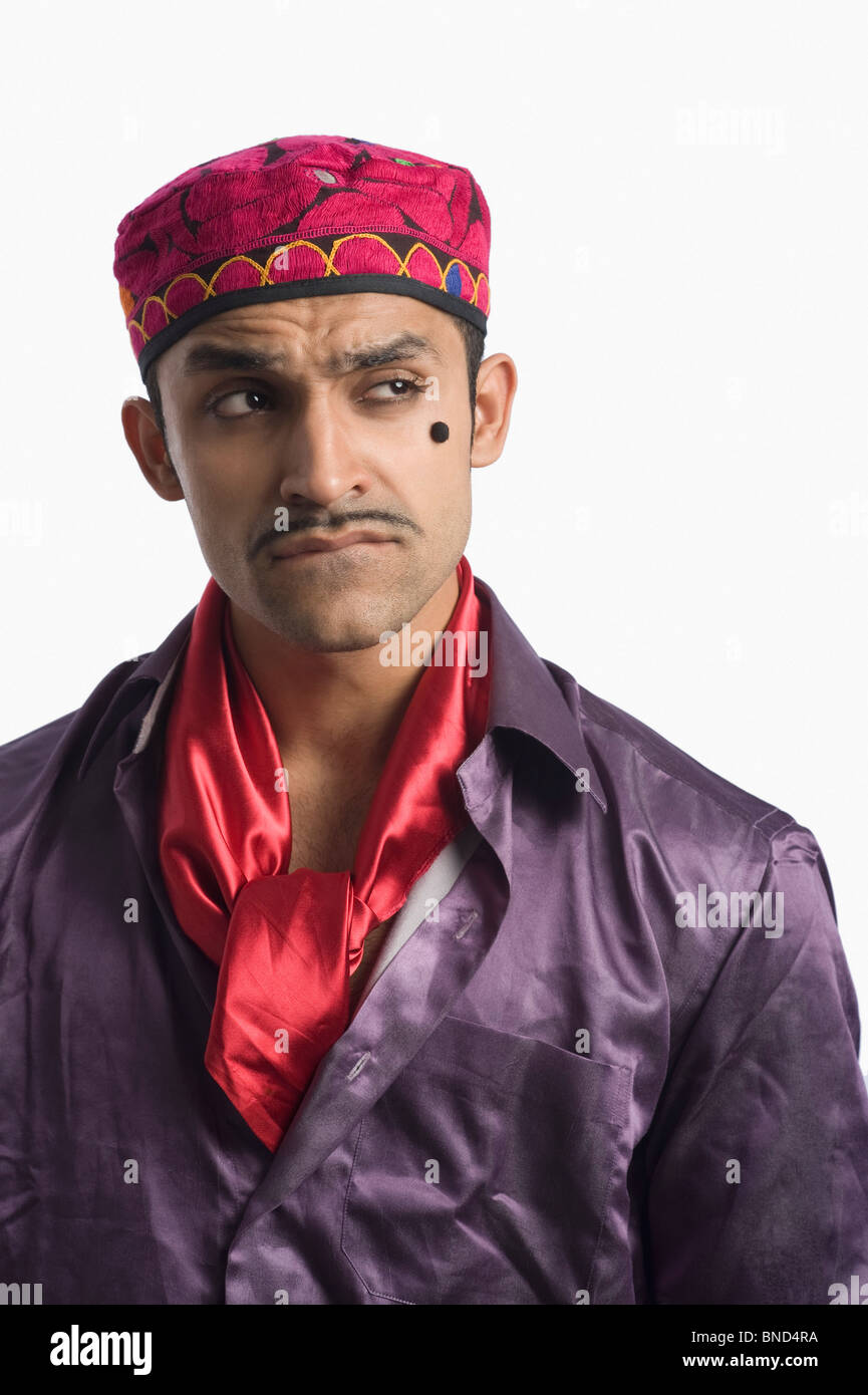 Close-up of an actor portraying a tapori and frowning Stock Photo - Alamy