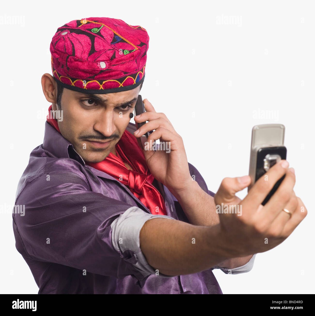 Close-up of an actor portraying a tapori using mobile phones Stock ...