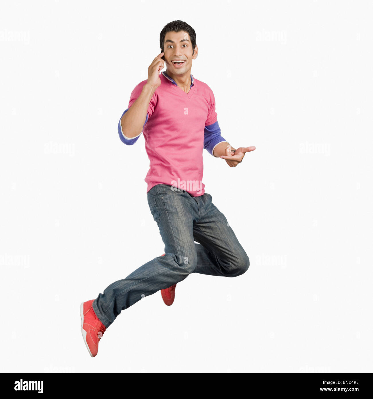 Portrait of an actor talking on a mobile phone Stock Photo - Alamy