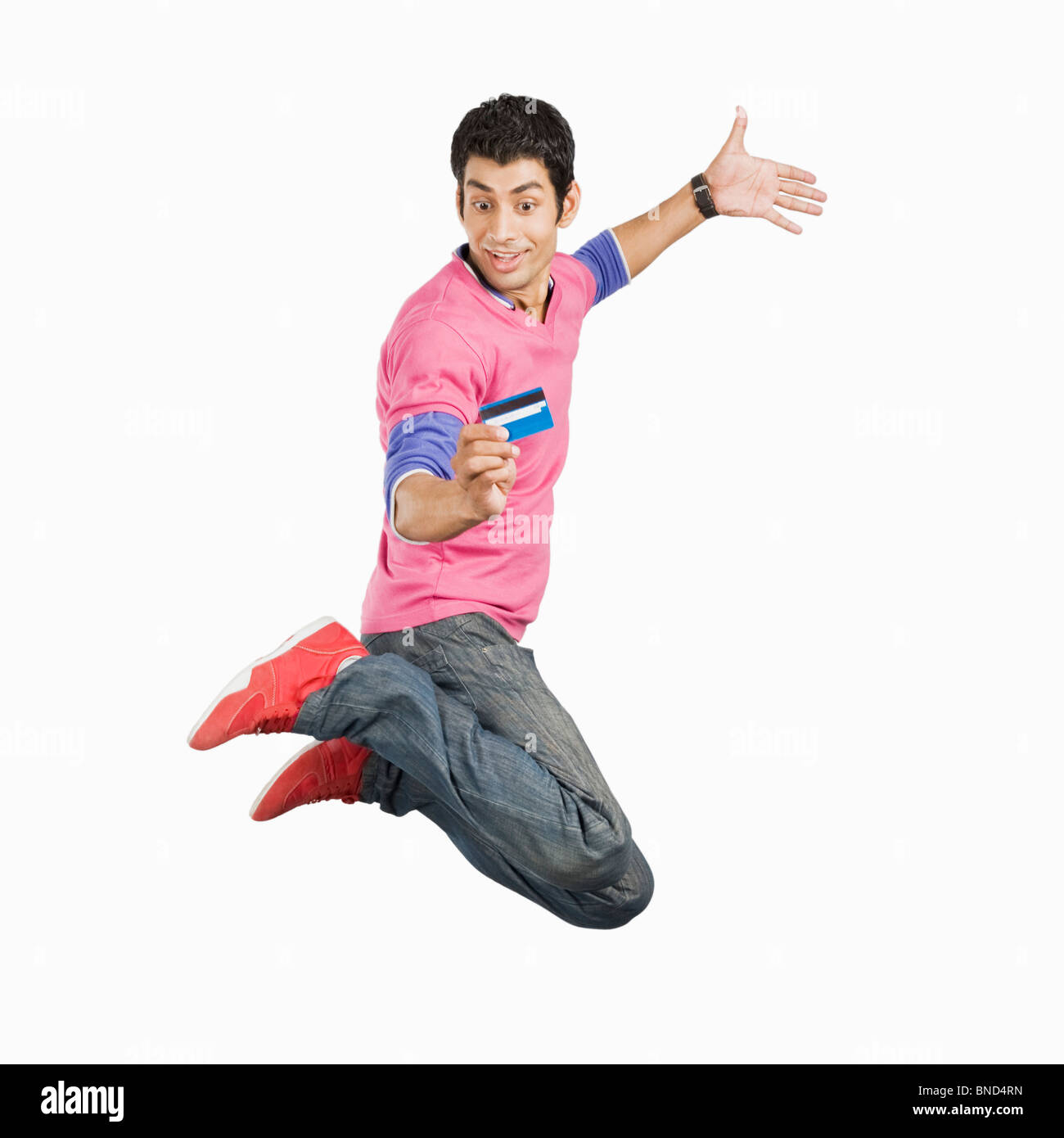 Asian man holding credit Cut Out Stock Images & Pictures - Alamy