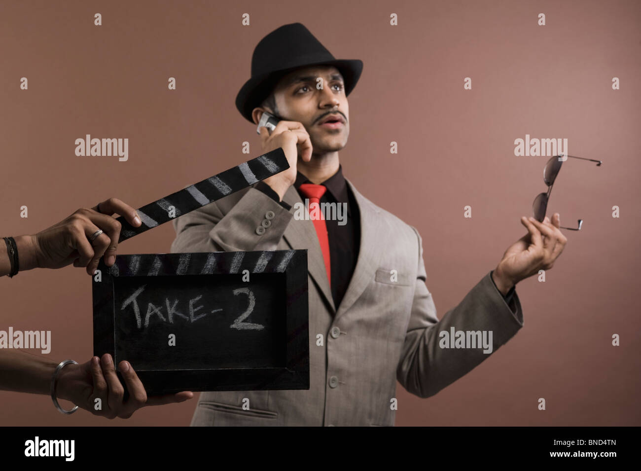 Actor portraying a businessman talking on a mobile phone Stock Photo ...