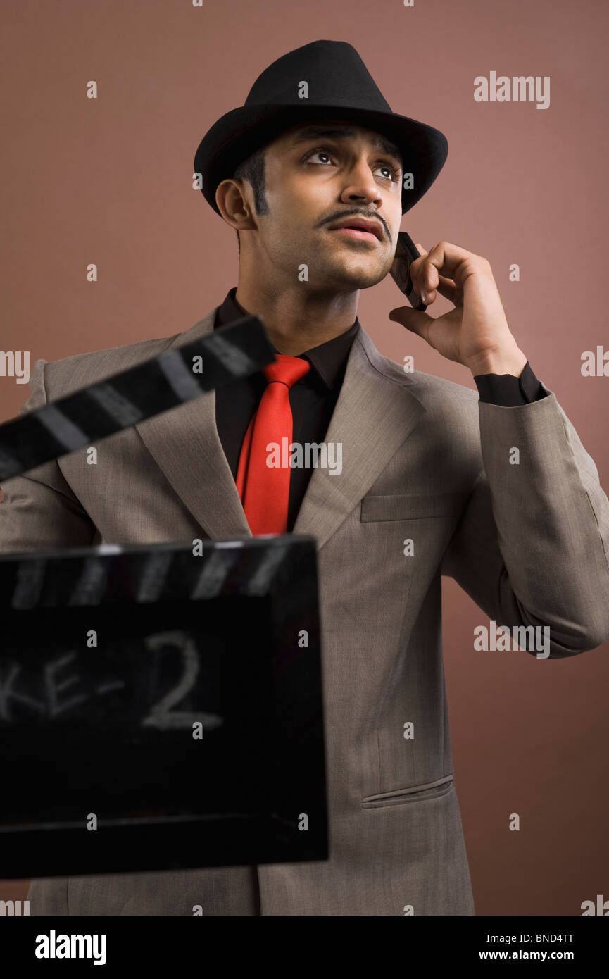 Actor portraying a businessman talking on a mobile phone Stock Photo ...
