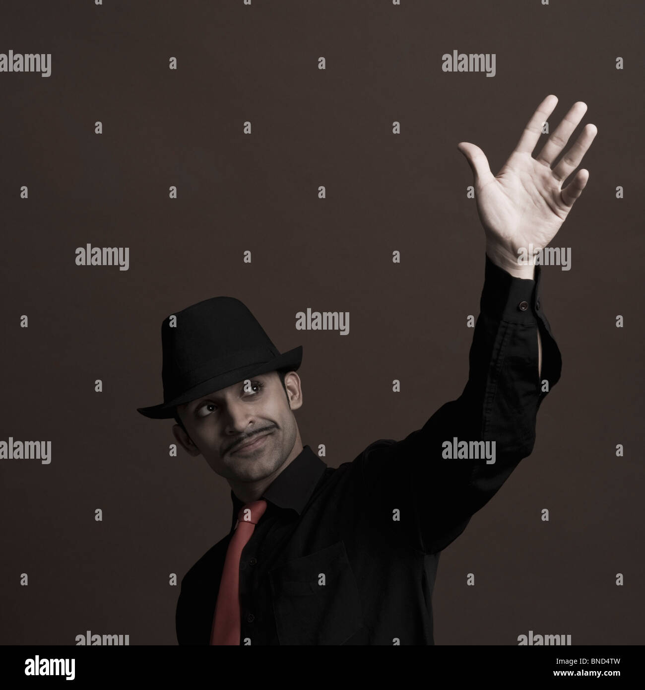 Actor portraying a businessman waving hand Stock Photo - Alamy