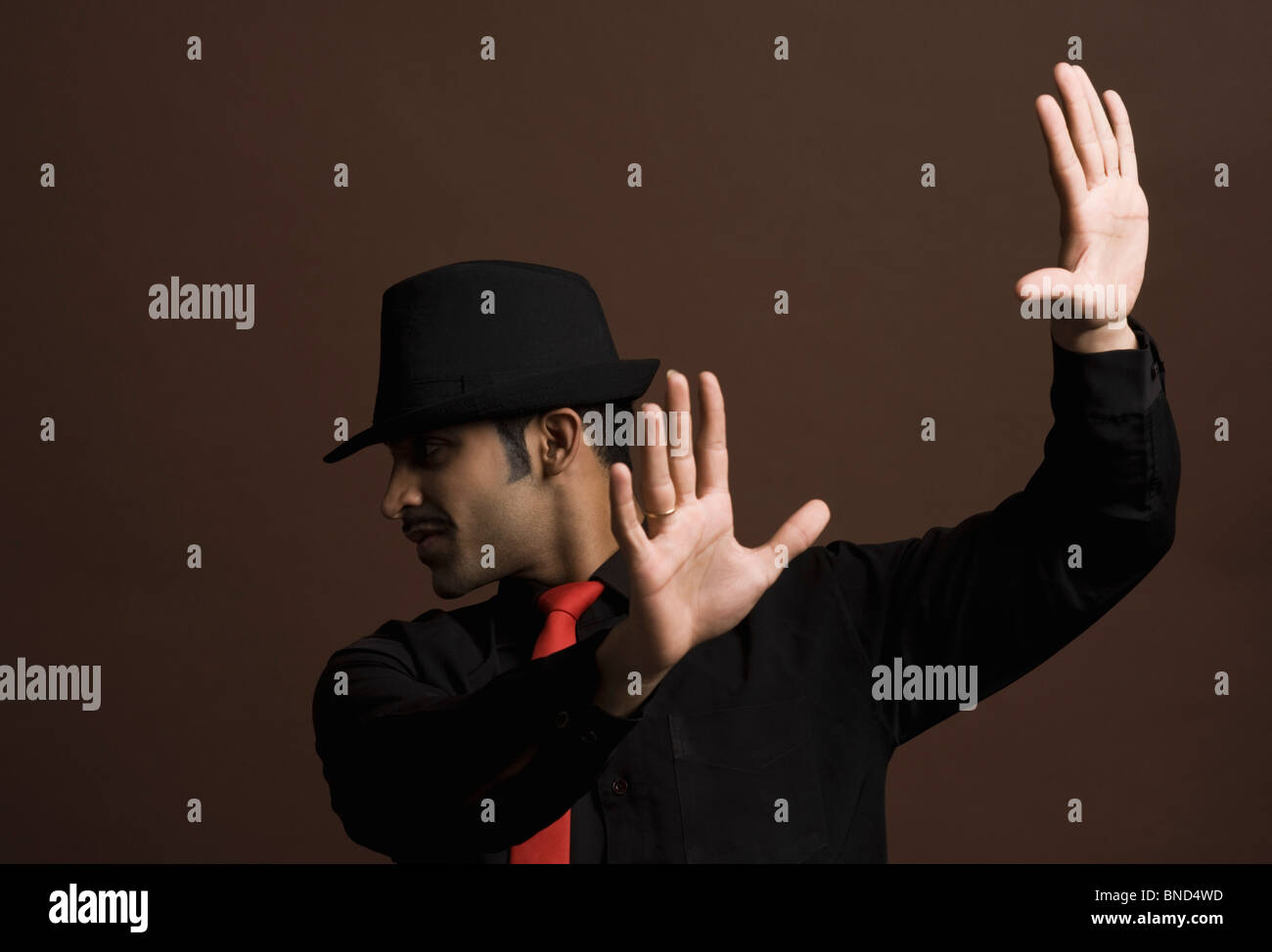 Actor portraying a businessman showing stop gesture Stock Photo - Alamy