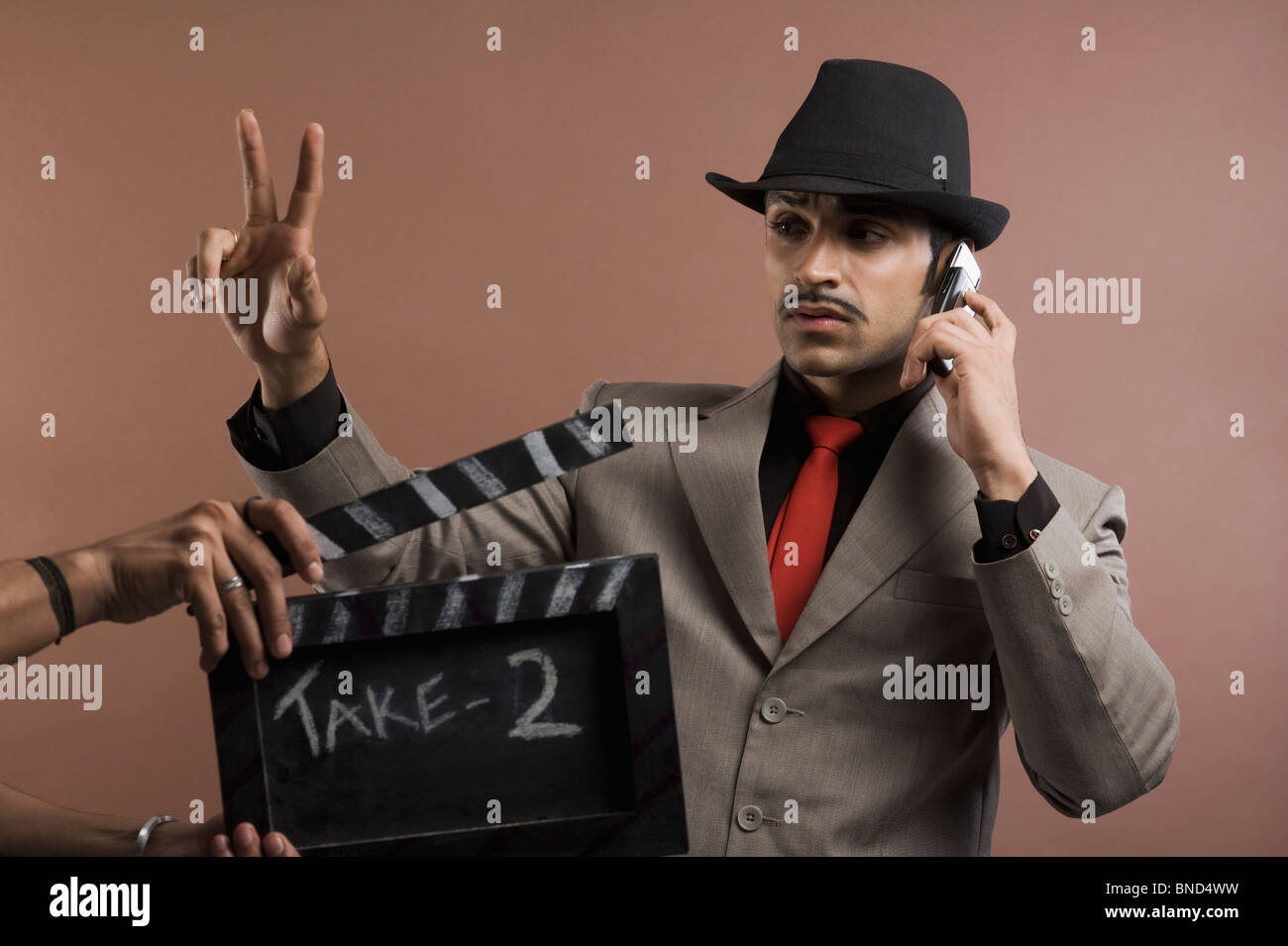 Actor portraying a businessman talking on a mobile phone Stock Photo ...