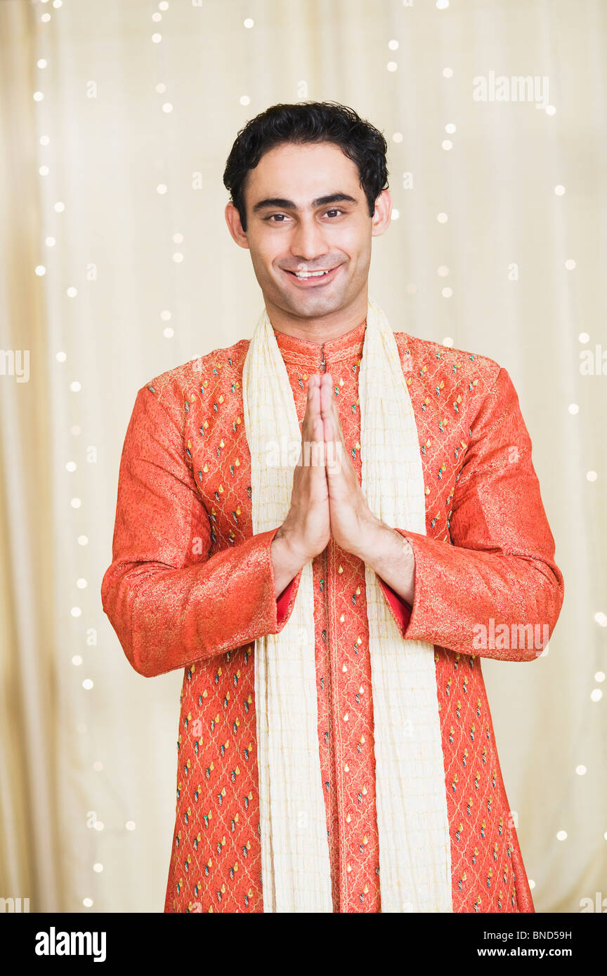 Portrait of a man greeting Stock Photo - Alamy