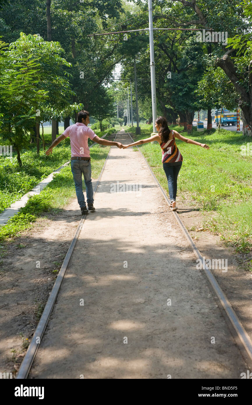 Couple walking on railroad tracks hi-res stock photography and images ...