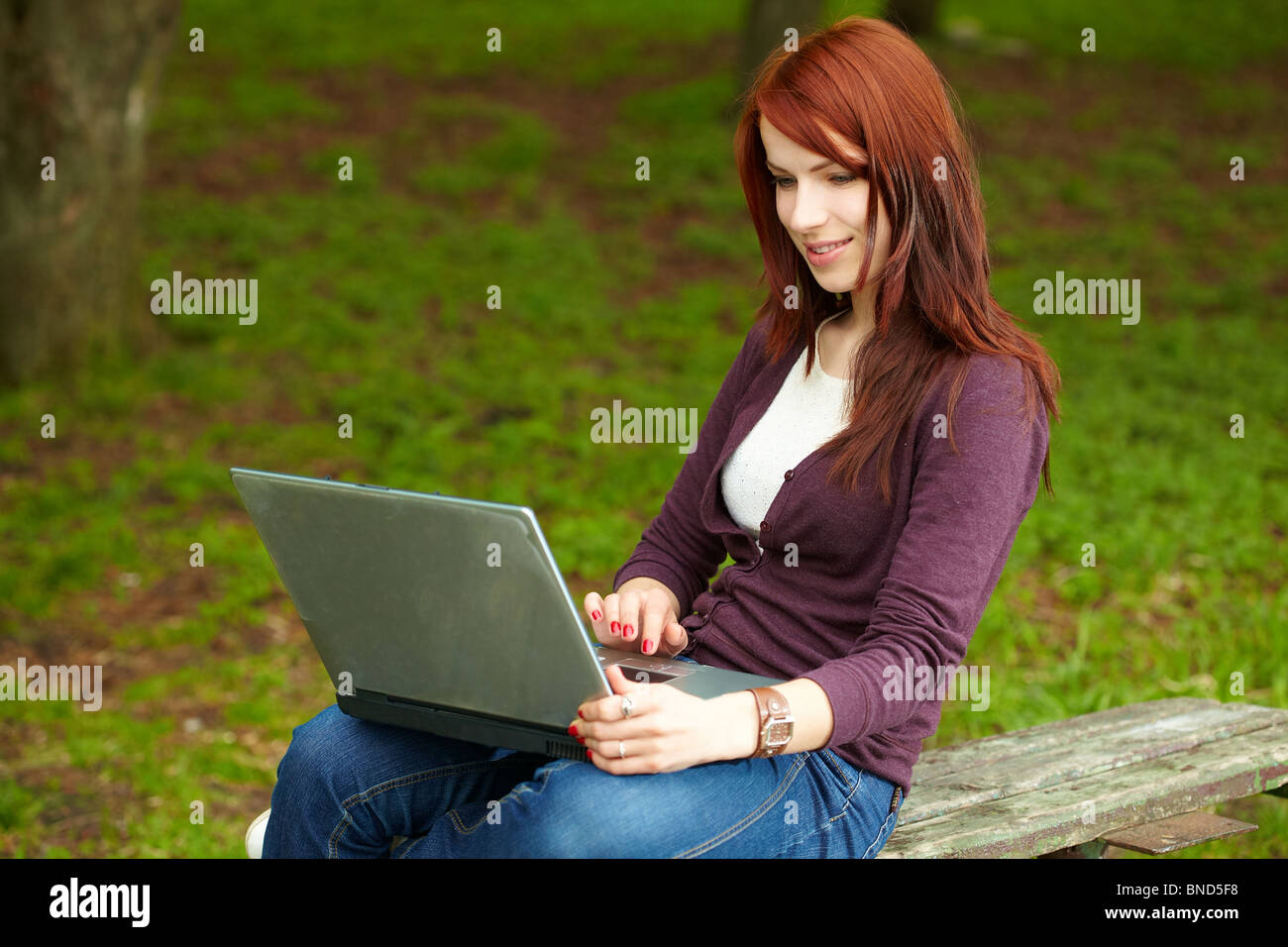 The girl with laptop on outdoor Stock Photo - Alamy