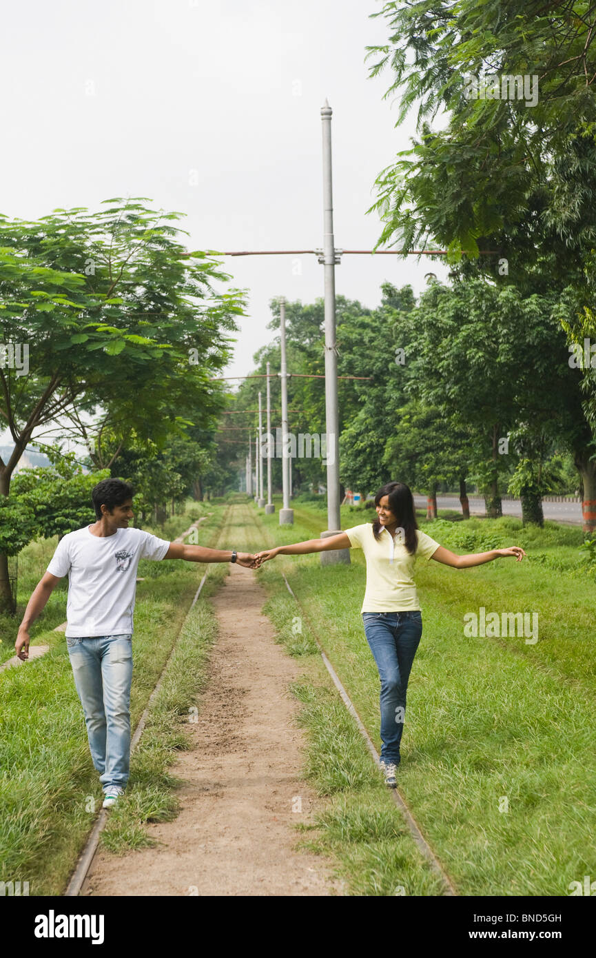 Couple walking on railroad tracks hi-res stock photography and images ...