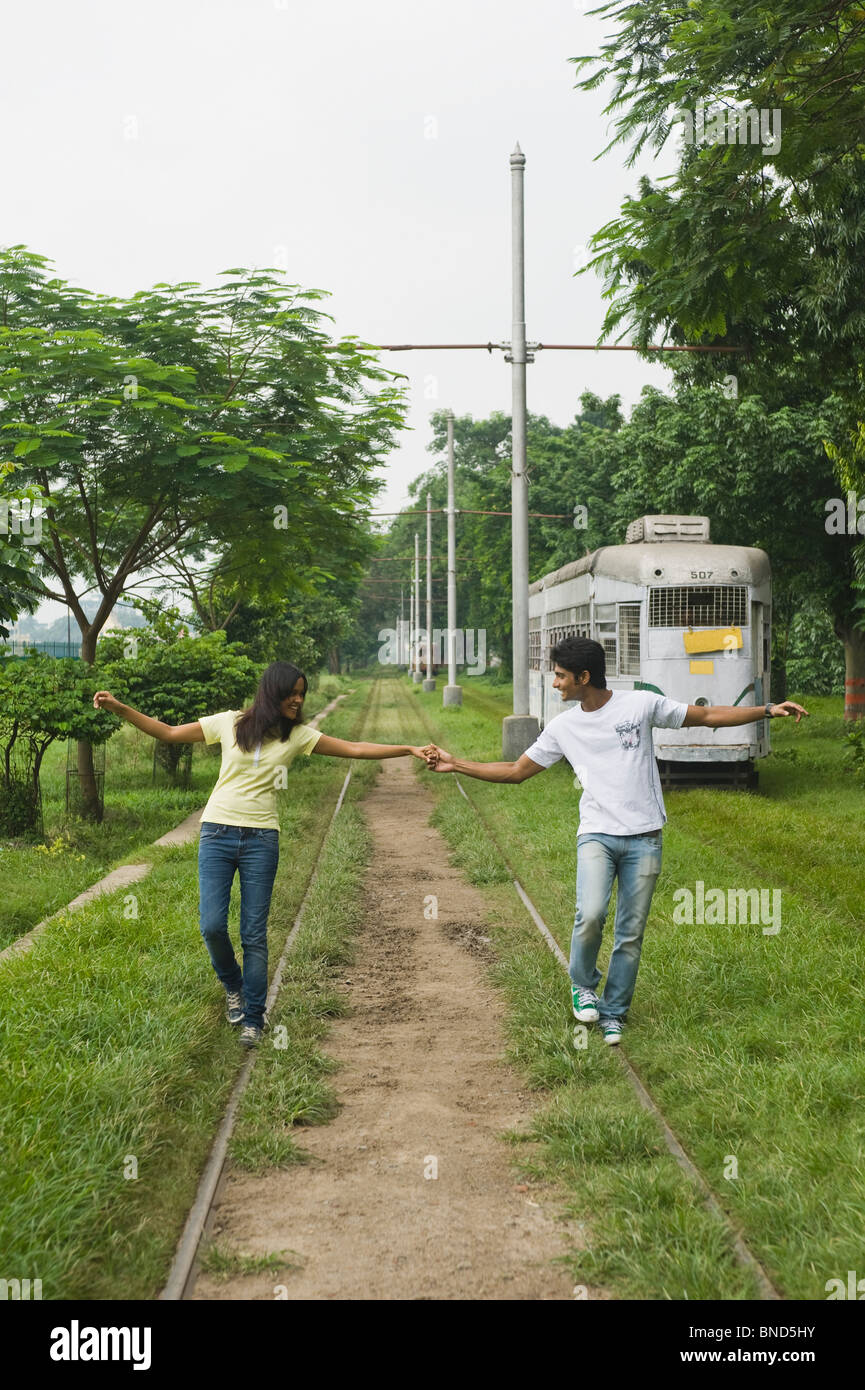 Couple walking on railroad tracks hi-res stock photography and images ...