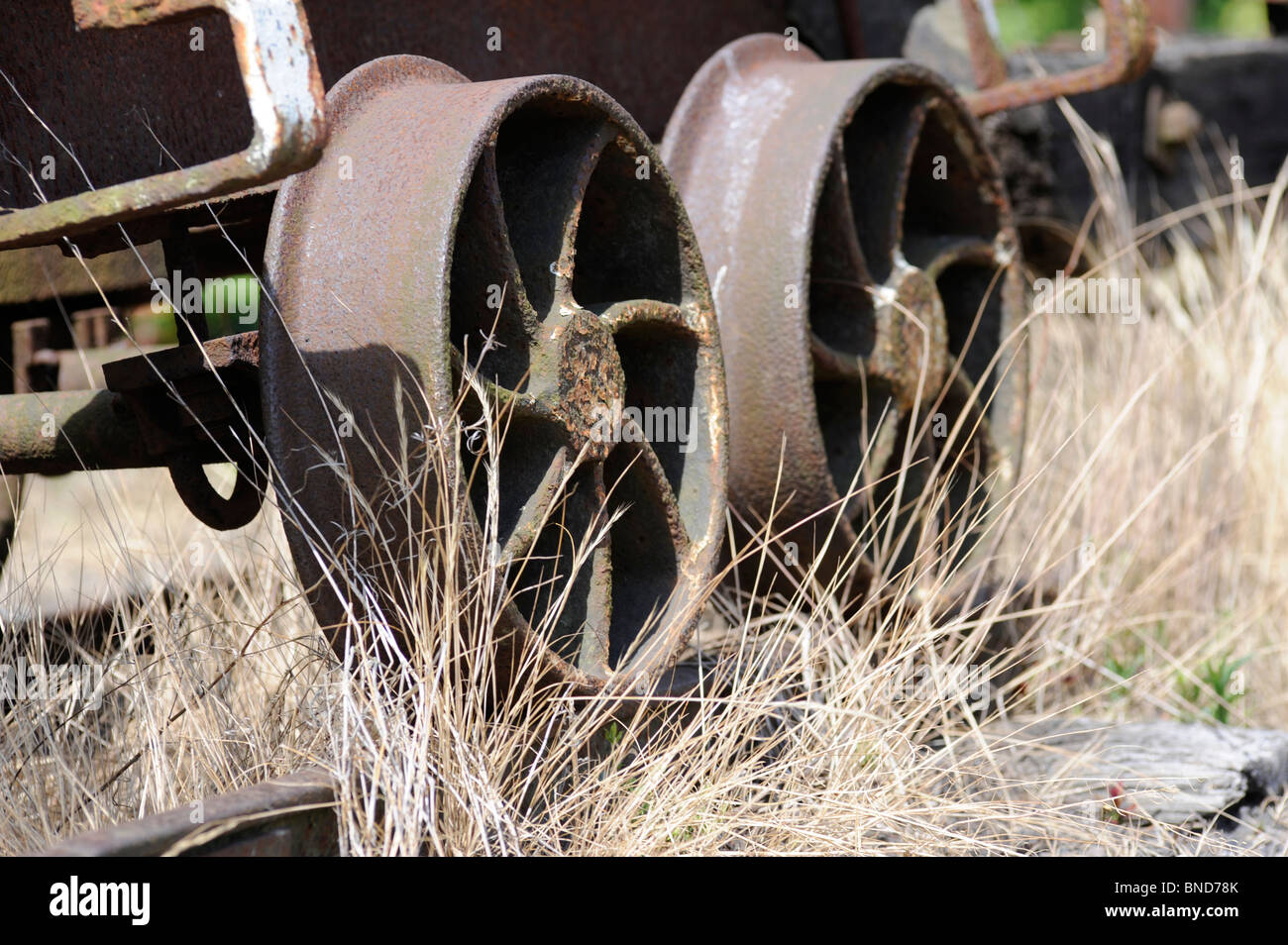 Unused and decaying wheels of a mining cart lie idle from neglect Stock ...