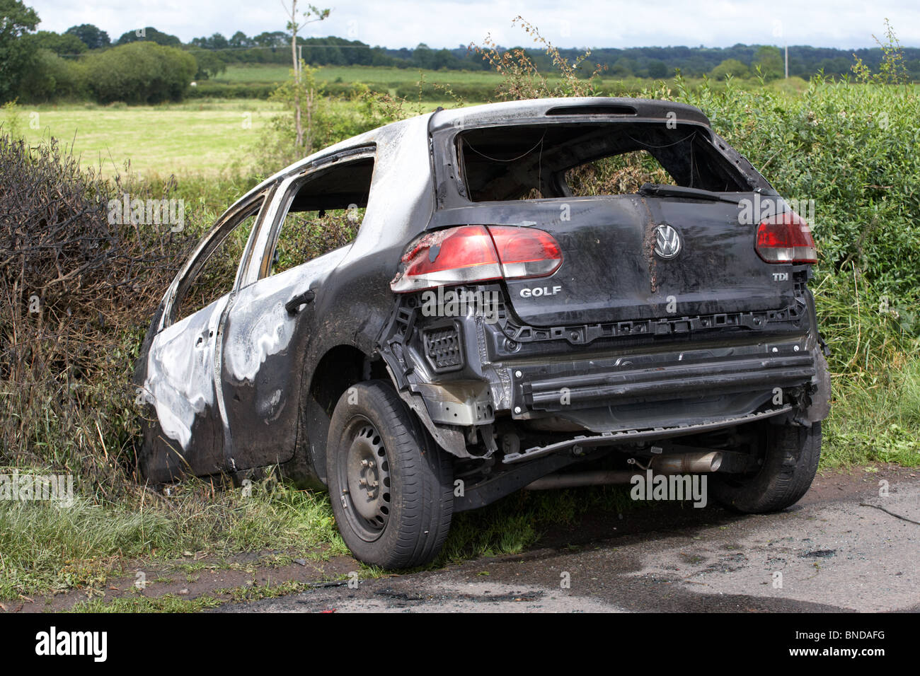 burned out stolen volkswagen golf car crashed into a ditch in northern ...