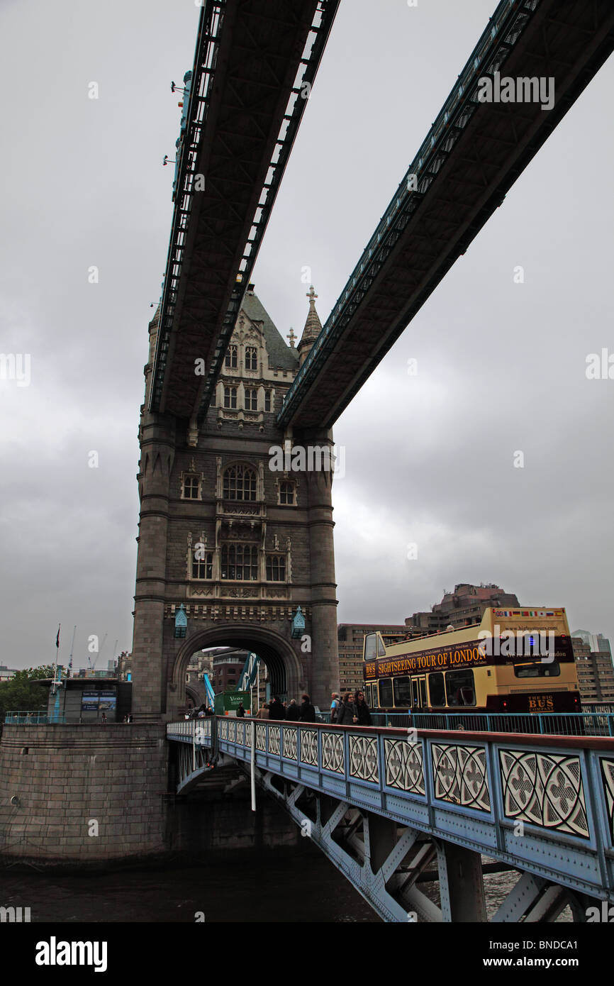 Tower Bridge in wide angle with tour bus crossing Stock Photo - Alamy