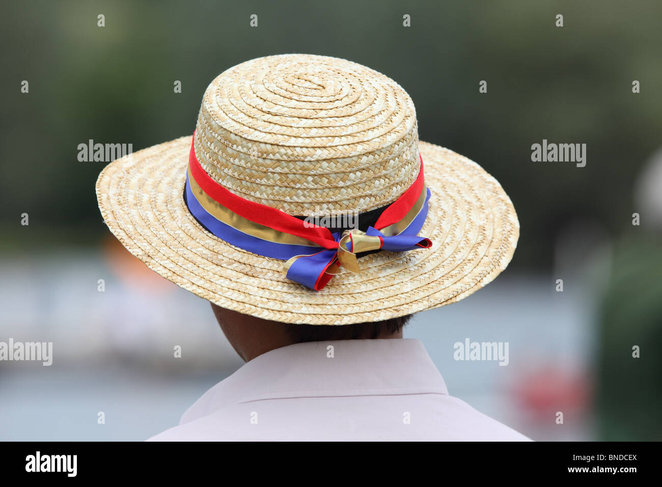 A back view of a straw hat at Henley regatta on the river Thames Stock ...