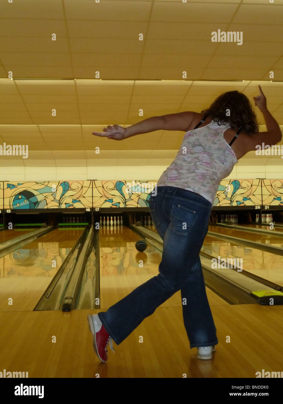Women throwing a Ten pin bowling ball Stock Photo - Alamy