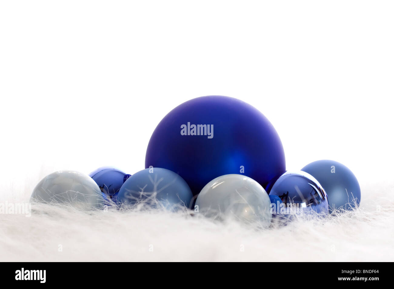 Arrangement of blue Christmas baubles on white fur Stock Photo - Alamy