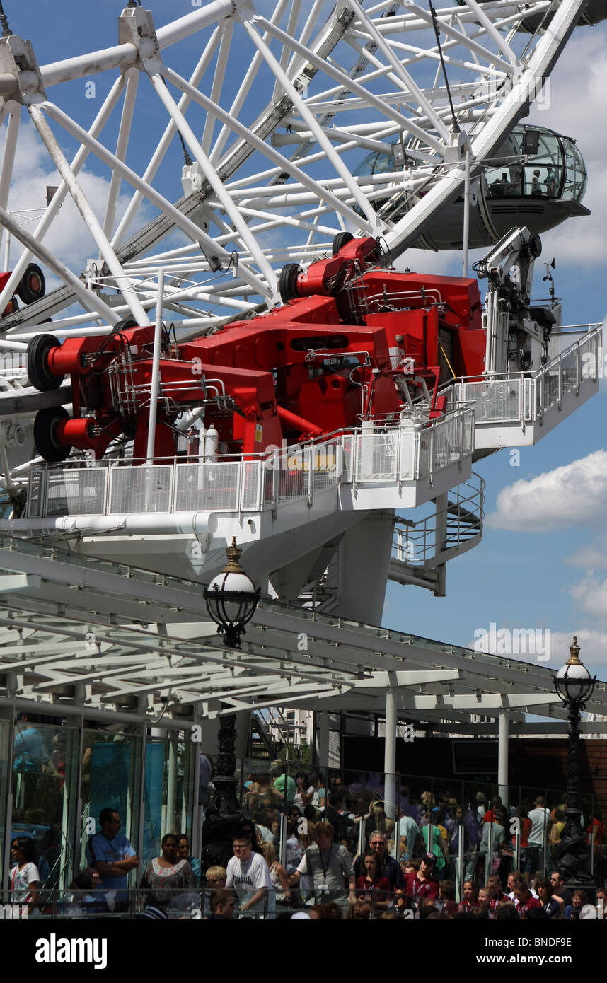 part of the structure of the London eye including people queuing for ...