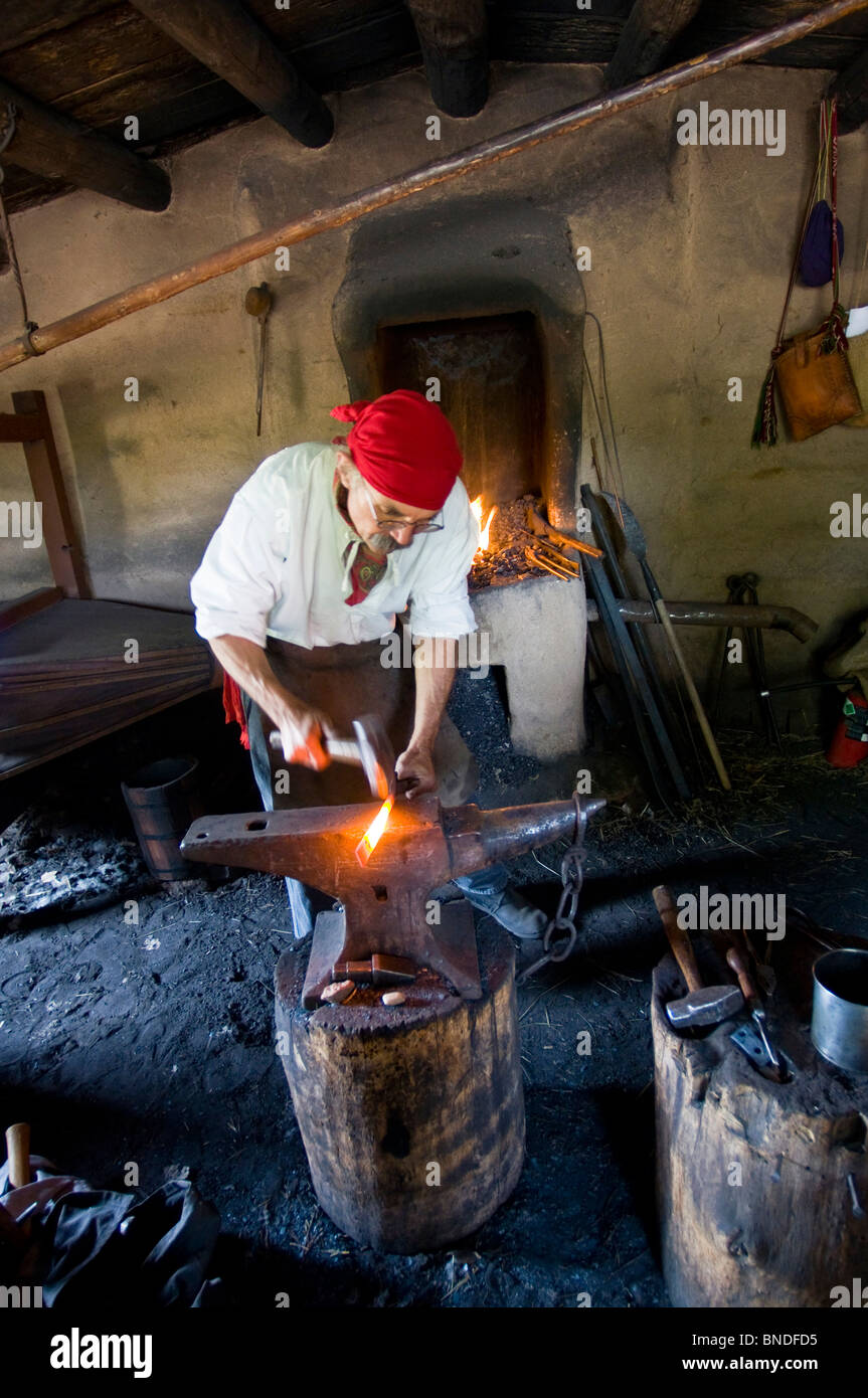 Blacksmith heating an iron pipe, Los Glondrias, New Mexico, USA Stock ...