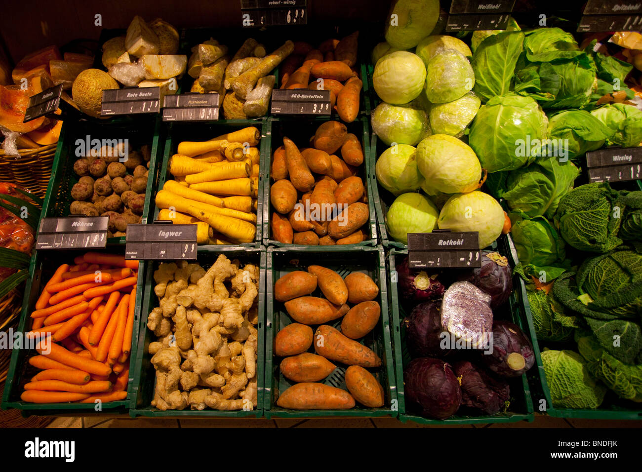 resh assortment of vegetables on display at a market, featuring carrots ...