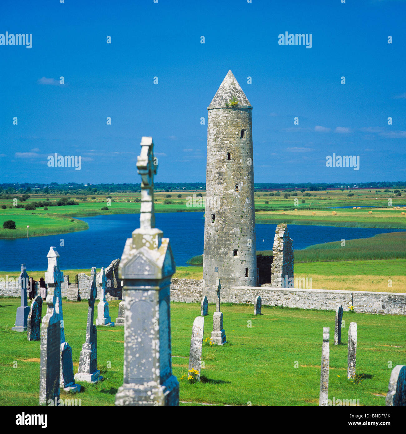 Graveyard and "McCarthy's" round tower, Clonmacnoise monastery, County ...