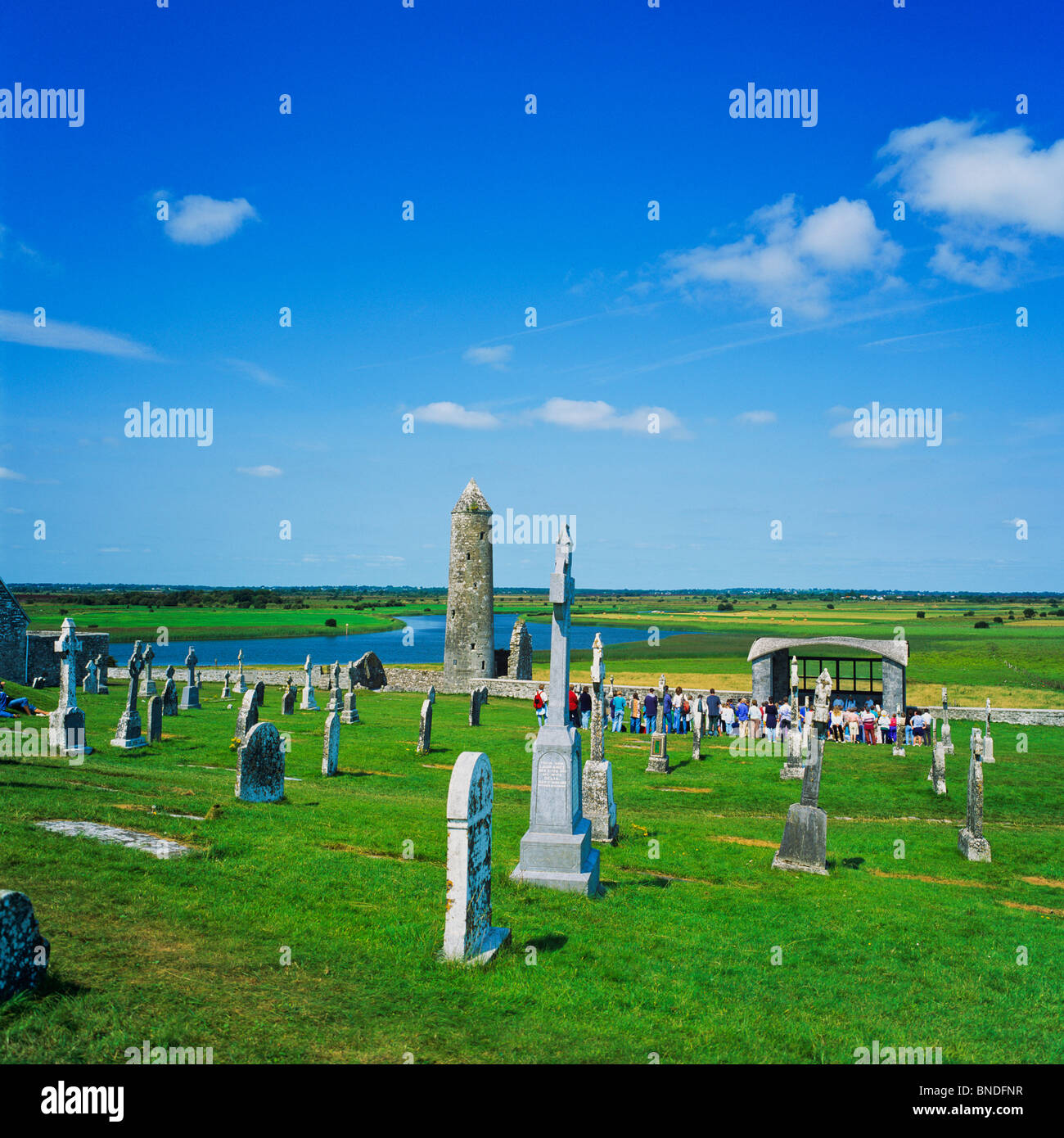 Graveyard and "McCarthy's" round tower, Clonmacnoise monastery, County ...