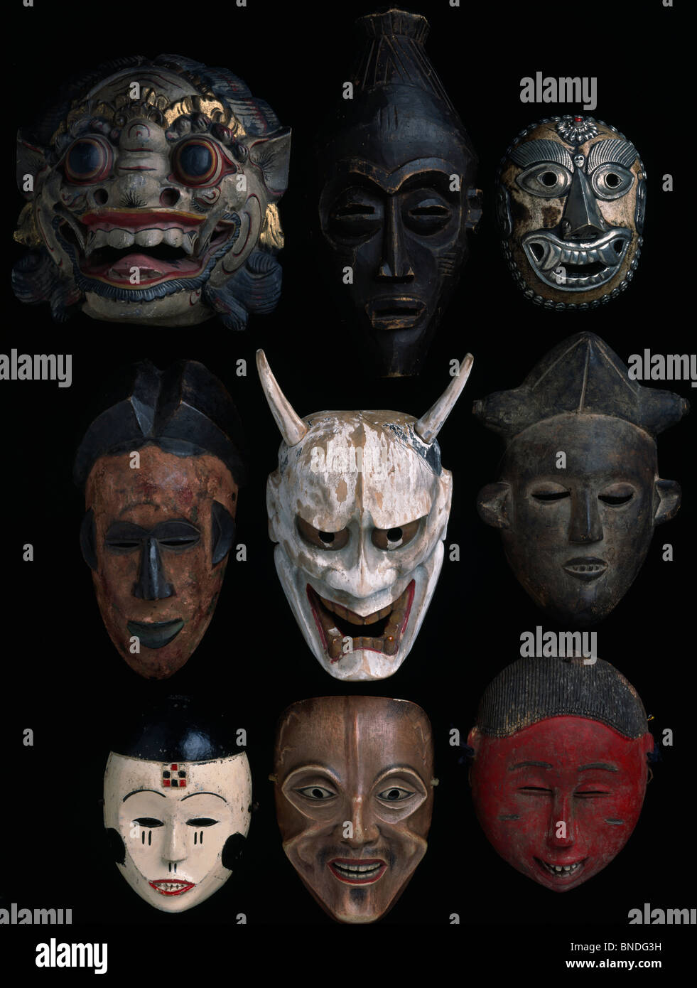 Face masks on black wall Stock Photo - Alamy