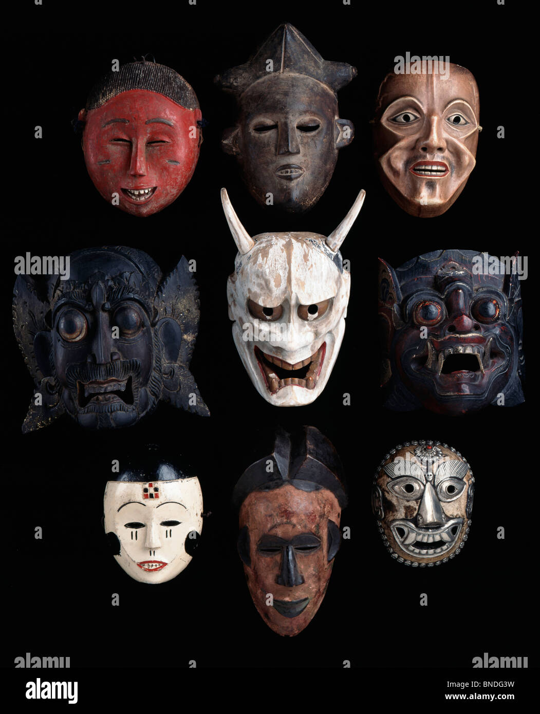Face masks on black wall Stock Photo - Alamy