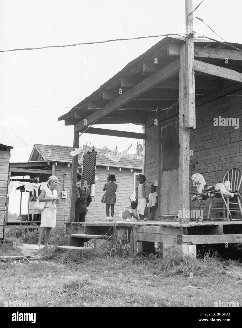 Woman standing on building Black and White Stock Photos & Images - Alamy