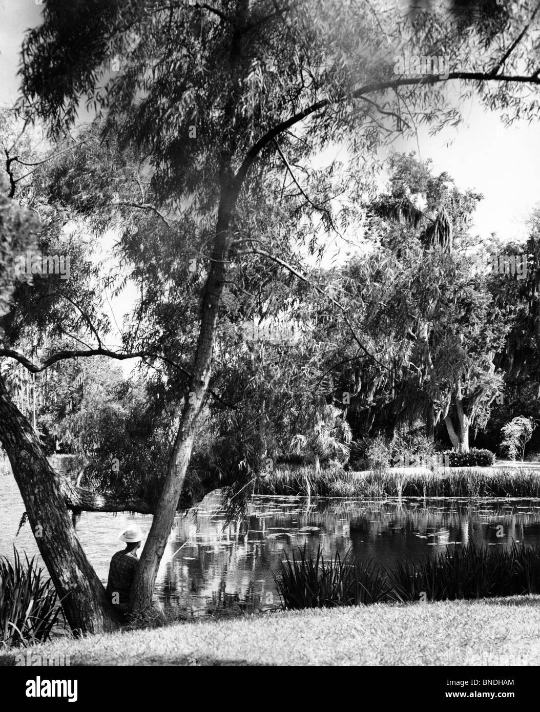 Man rod fishing in Black and White Stock Photos & Images - Alamy