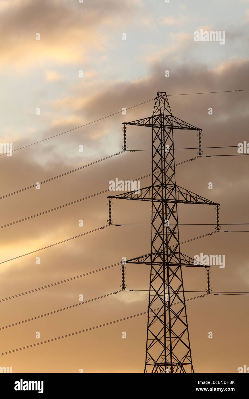 Sunset behind power pylon Stock Photo - Alamy