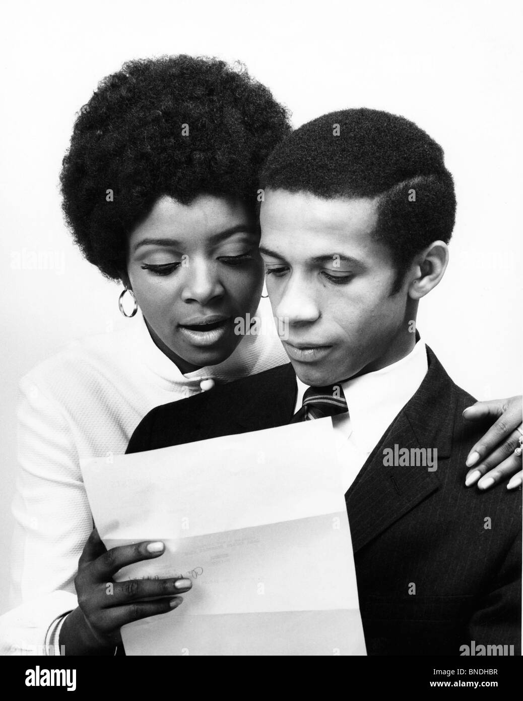 Holding paper reading Black and White Stock Photos & Images - Alamy