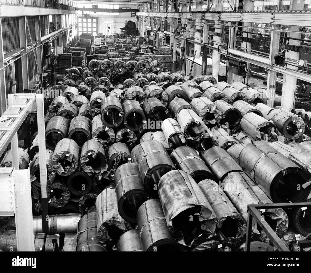 High angle view of rolls of steel in a warehouse Stock Photo - Alamy