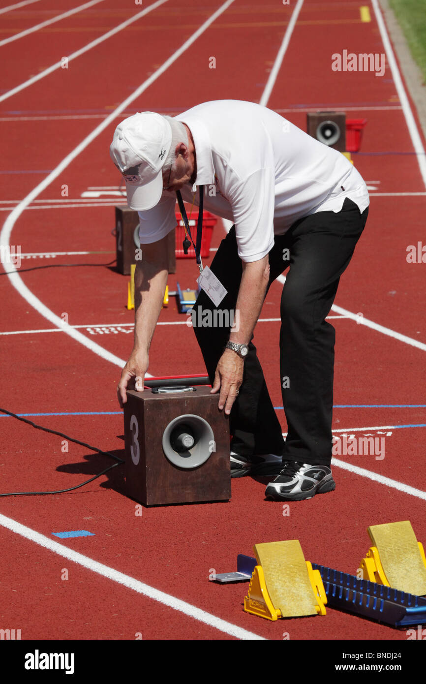 Official sets up detail start the Men's 400m at Natwest Island Games ...
